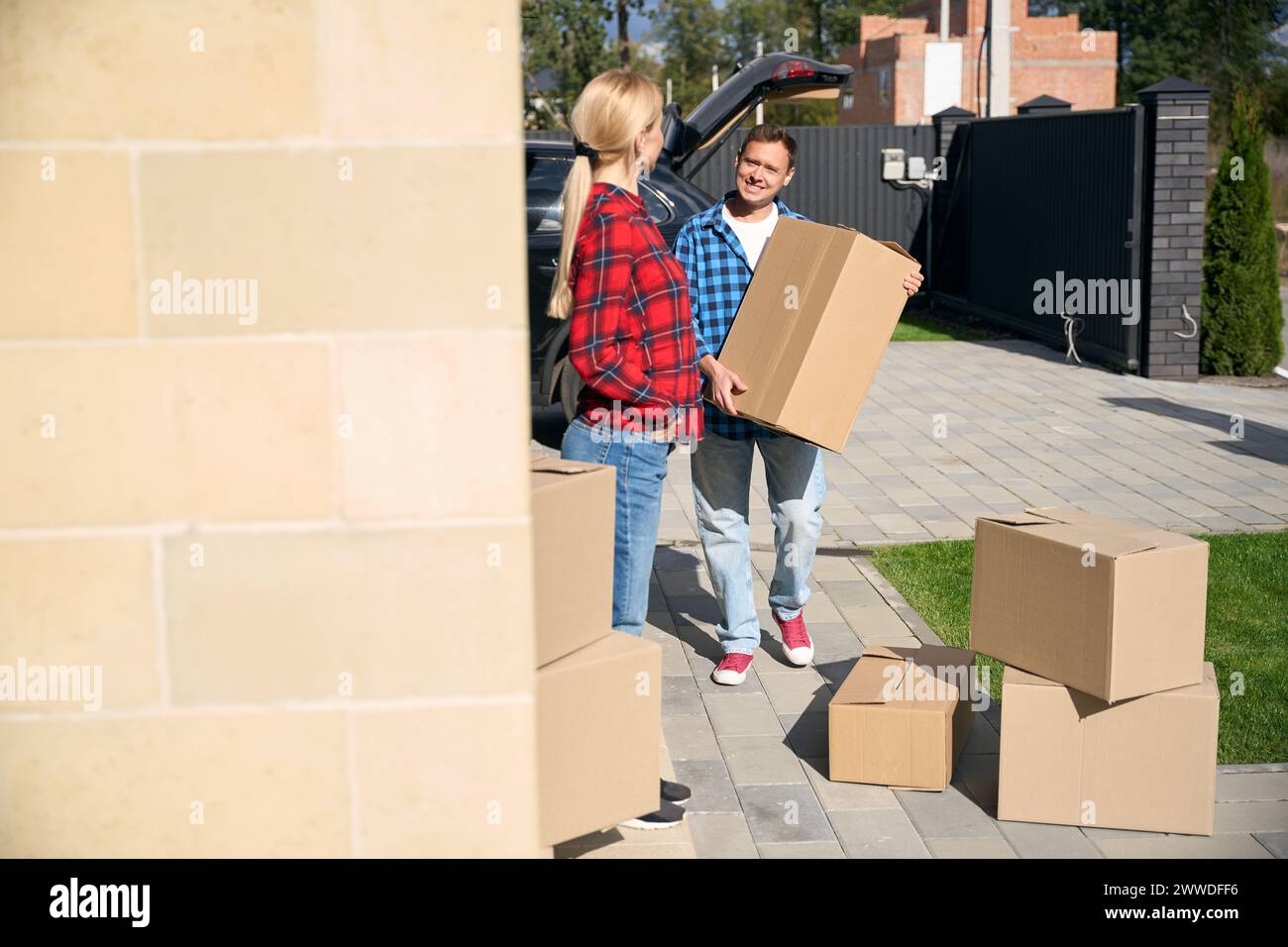 Couple standing on doorstep hi-res stock photography and images - Alamy