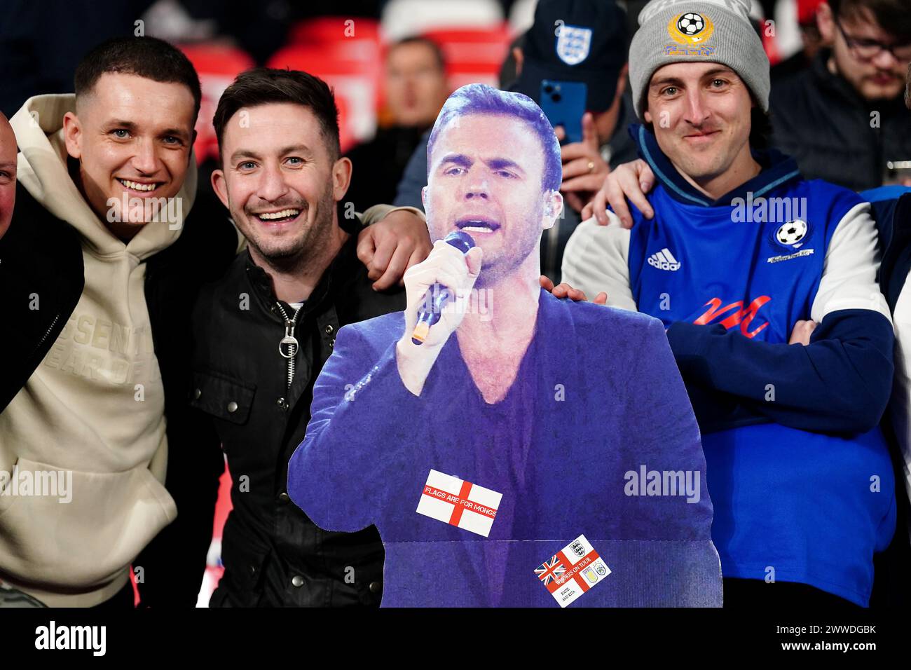 England fans pose with a cardboard cutout of singer Gary Barlow during ...