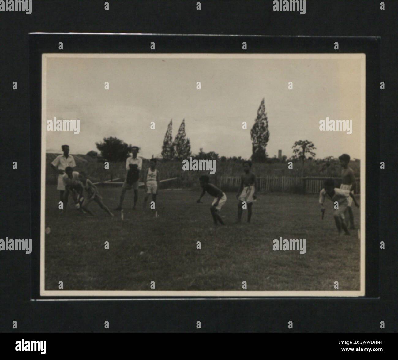 An inter-school relay race in Singapore, Malaya, showcasing students ...