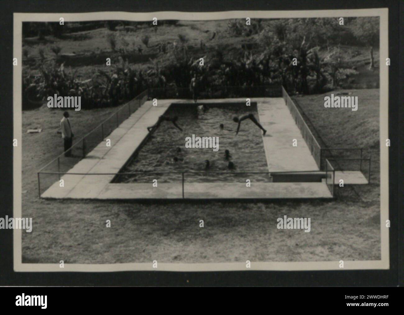 Description: The Industrial School. The swimming bath; a class in ...