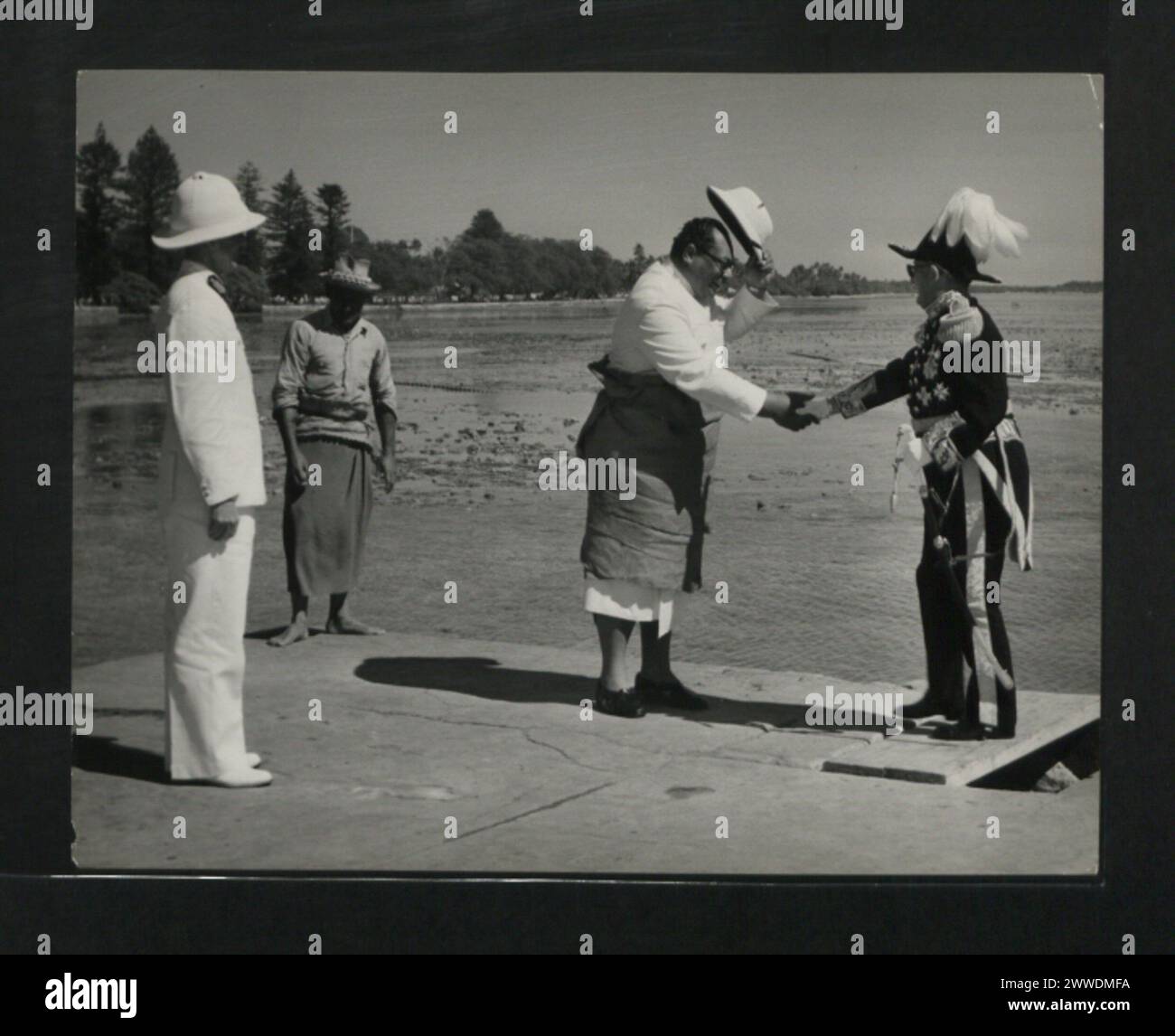 Description: Prince Tungi greets Sir Ronald on his arrival in Tonga. On ...