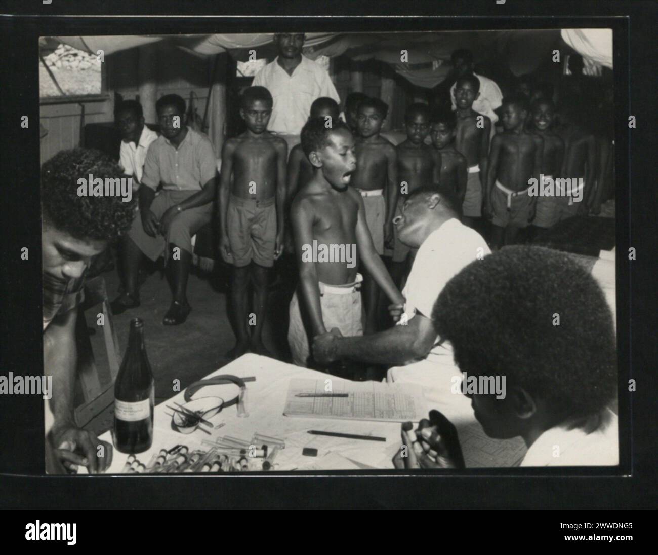 Description: The anti-yaws campaign. Schoolchildren being examined by a ...