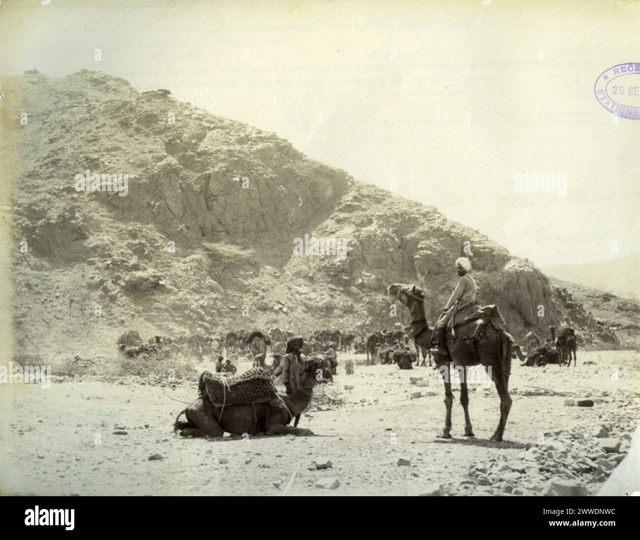 Tambouk Description: "Photograph of Tambouk with Camels carrying water to troops." Photograph ...