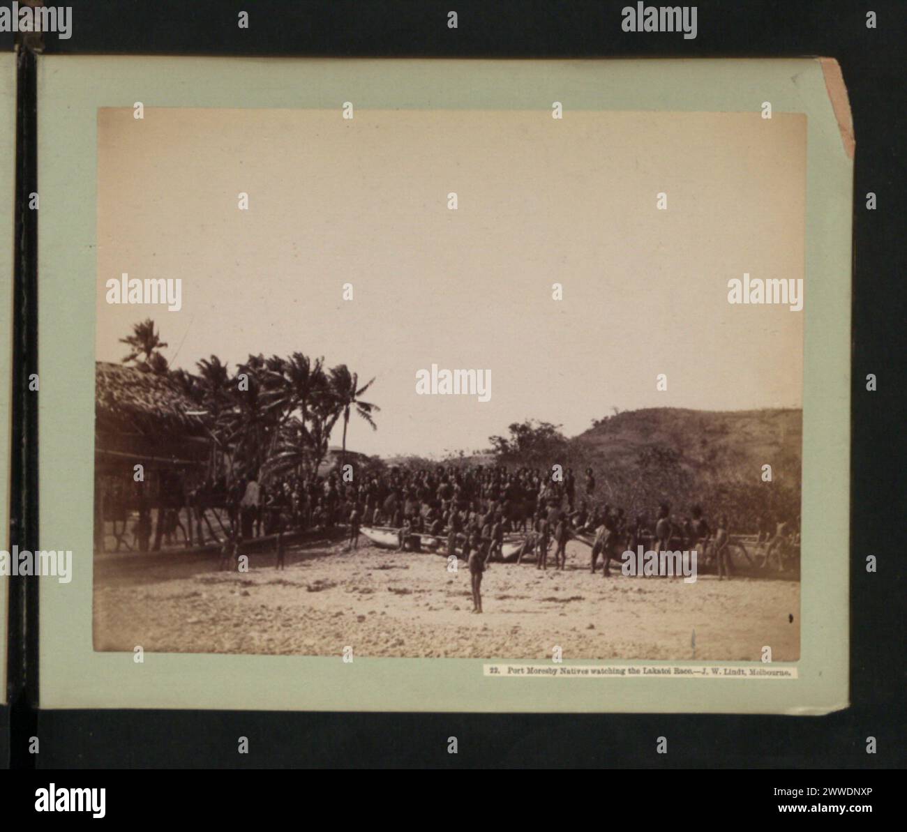 Photograph showing natives in Port Moresby, Papua New Guinea, observing ...