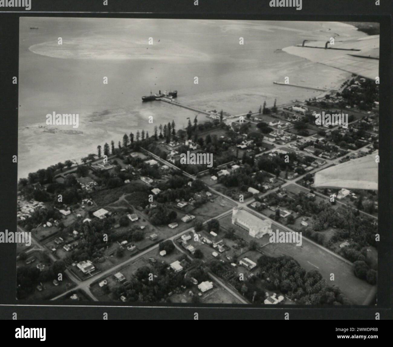 Description: A section of Nukualofa from the air. In the centre ...