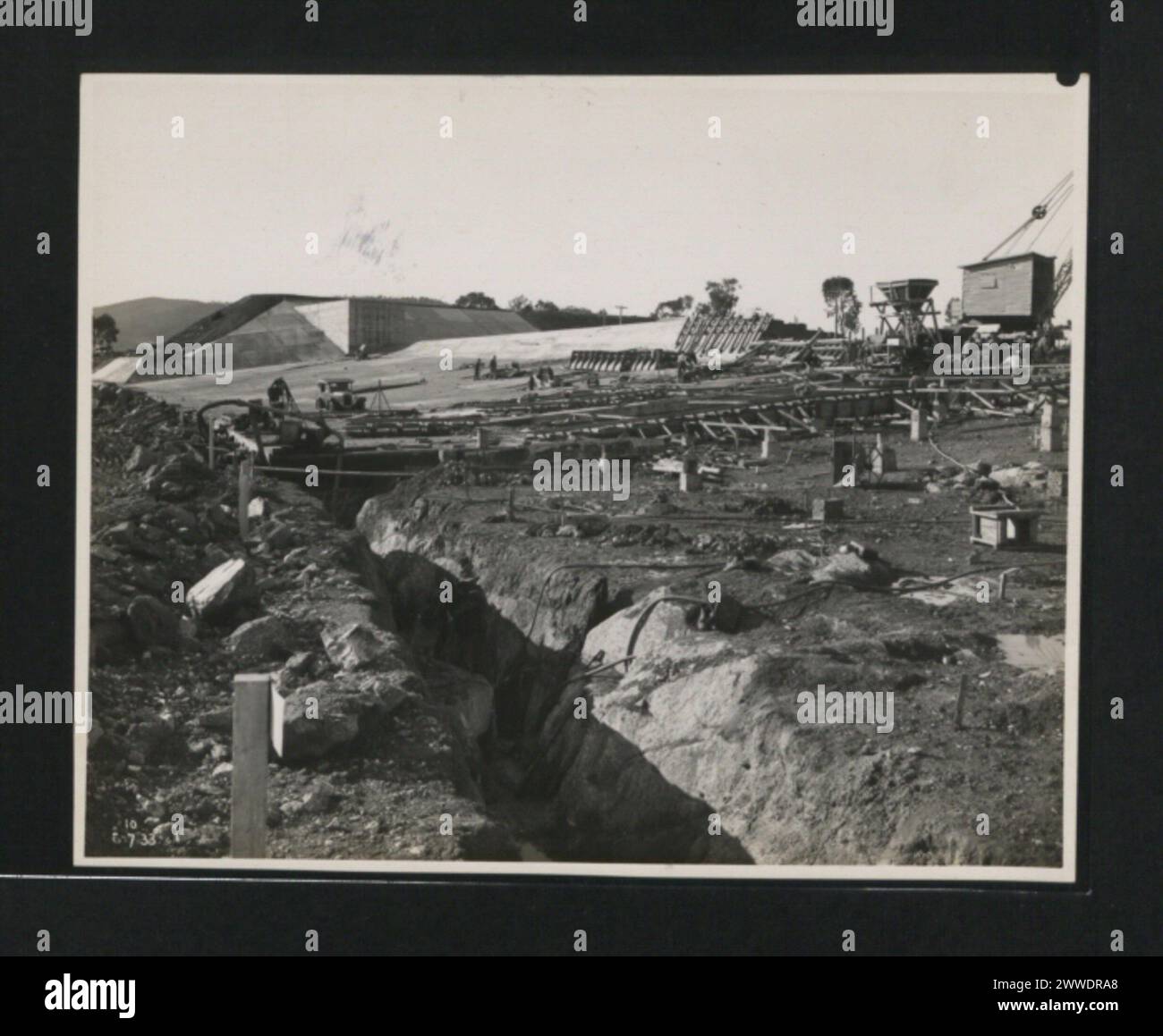 Description: Concreting spillway west and apron, showing trench for toe ...