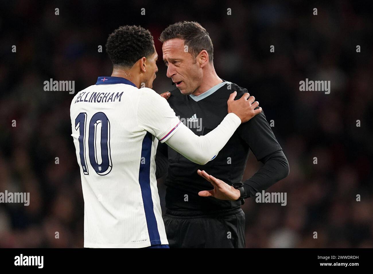 England's Jude Bellingham (left) speaks with Match referee Artur Manuel ...