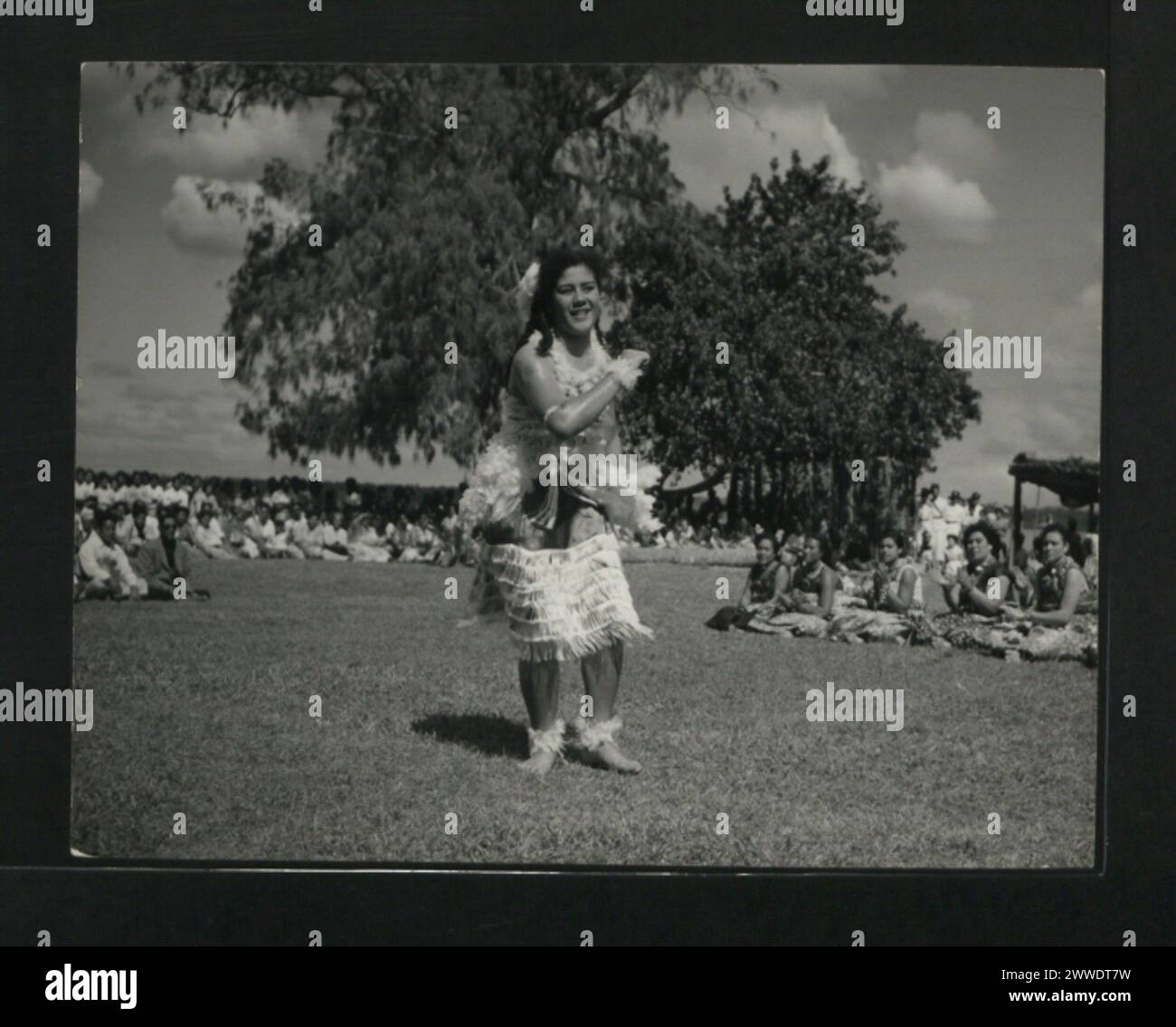 A young Tongan girl performs a traditional dance during an ...