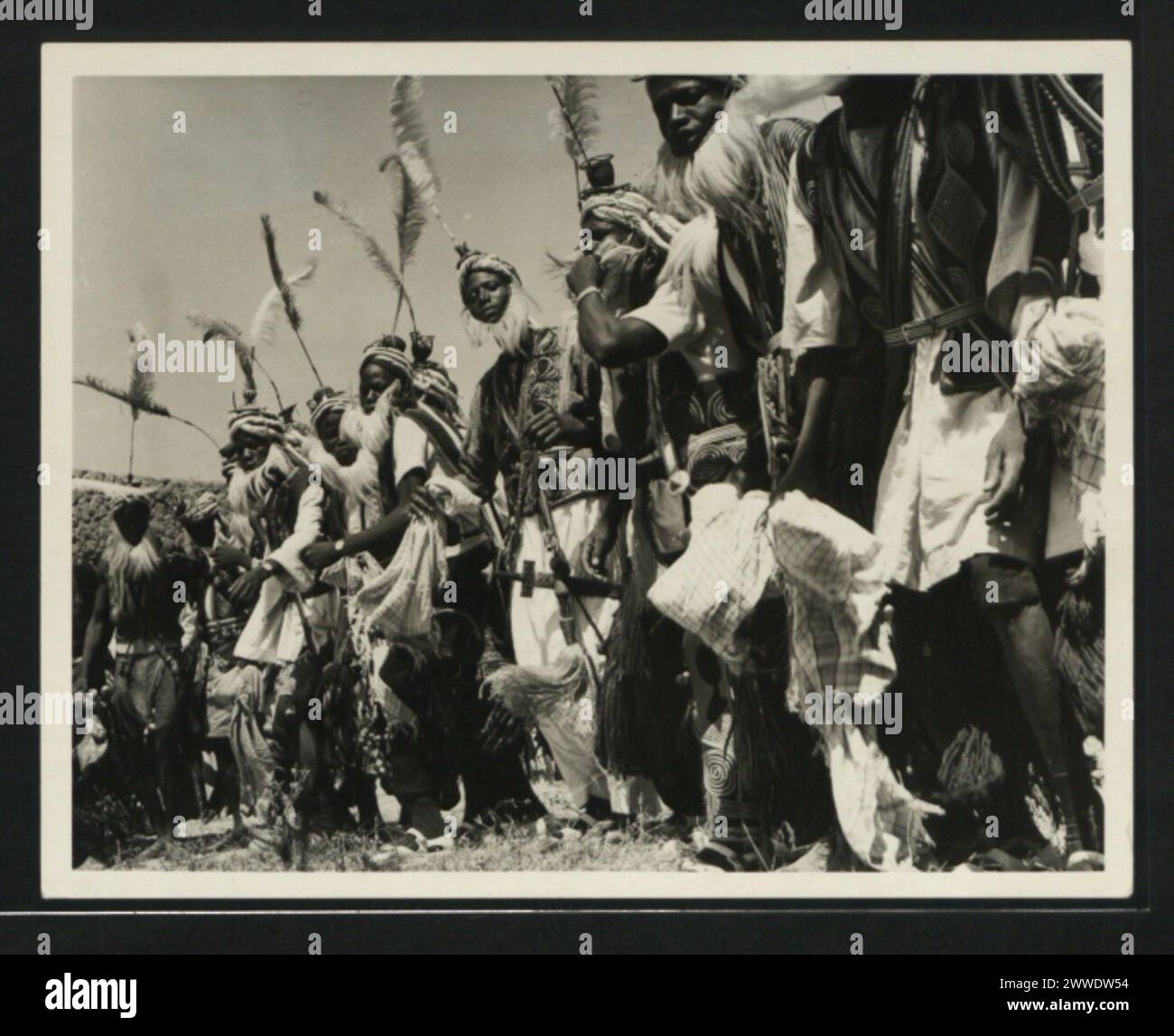 Description: Tribesmen greeting visiting Mission - Mubi. Location: Mubi ...