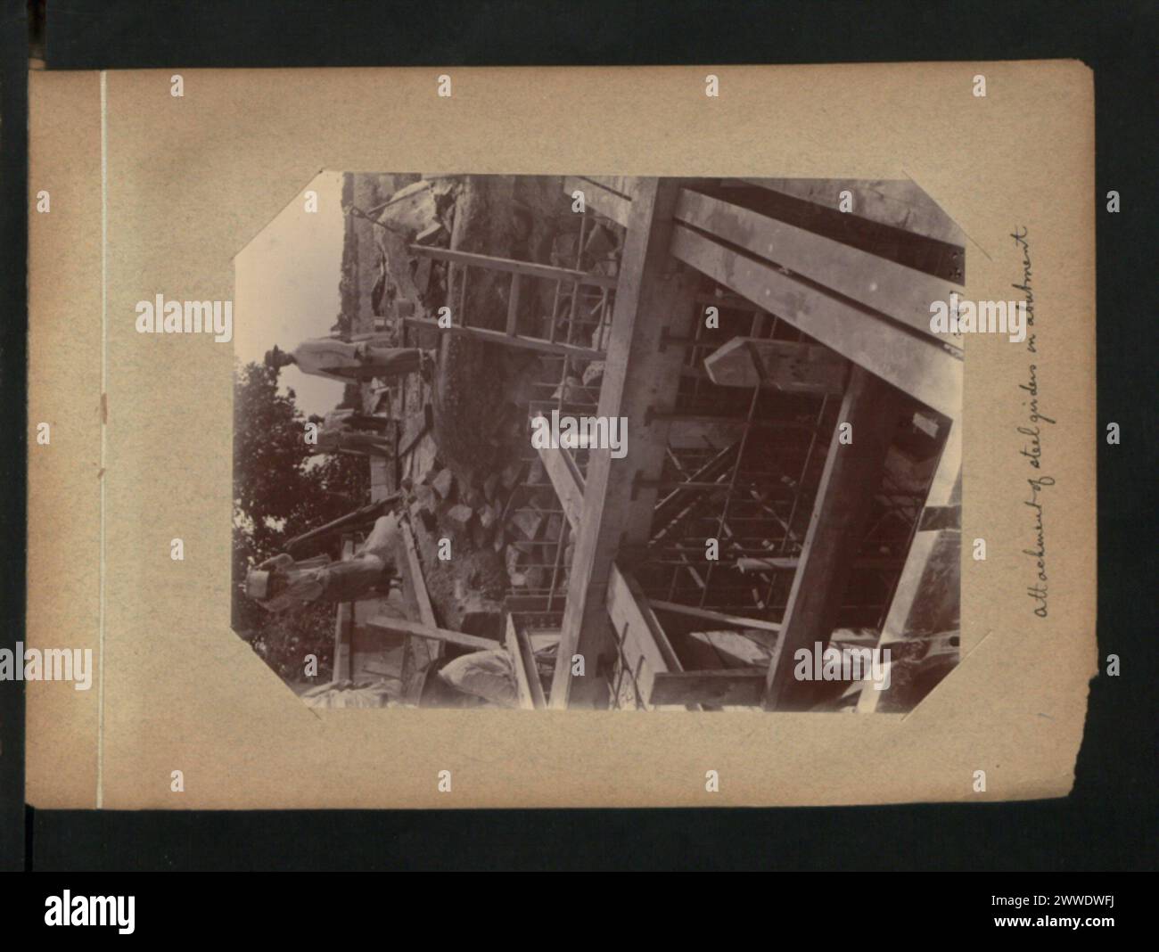 Photograph showing the attachment of steel girders to a bridge abutment ...