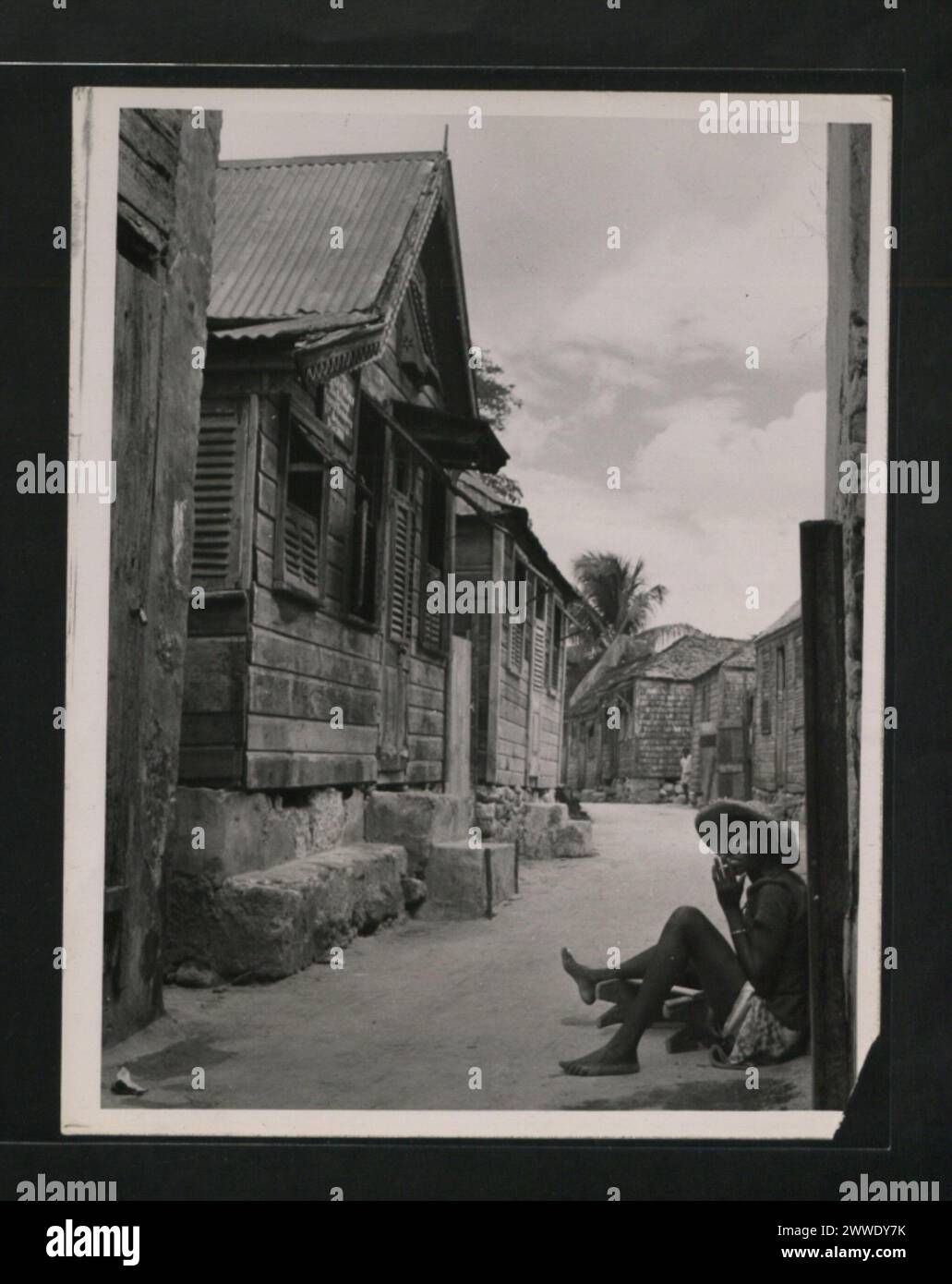 Photograph from 1950-1959 showing a narrow side street on the outskirts ...