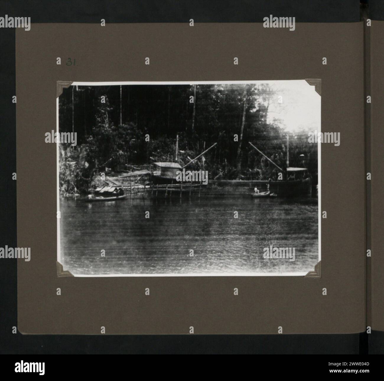 Description: A timber lighter loading logs at the point at the timber ...