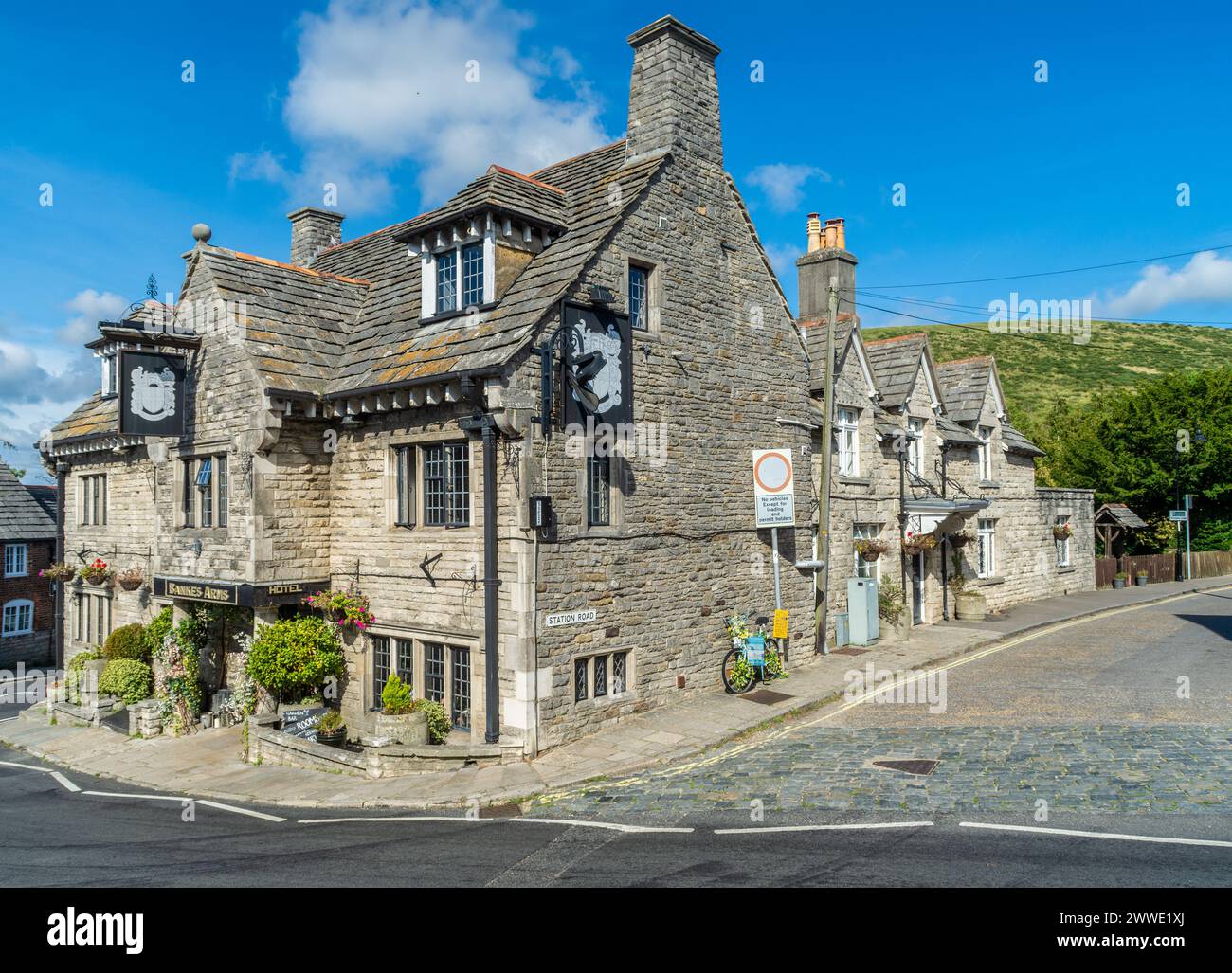 East Street, Corfe Castle, UK - September 14th 2023: A stone walled pub ...