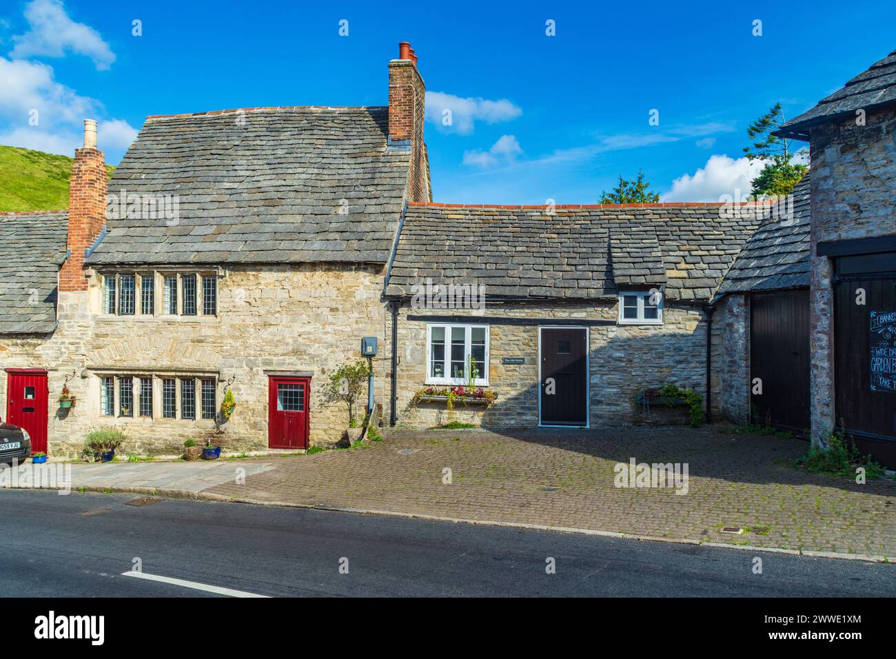 East Street, Corfe Castle, UK - September 14th 2023: A Stone house in ...