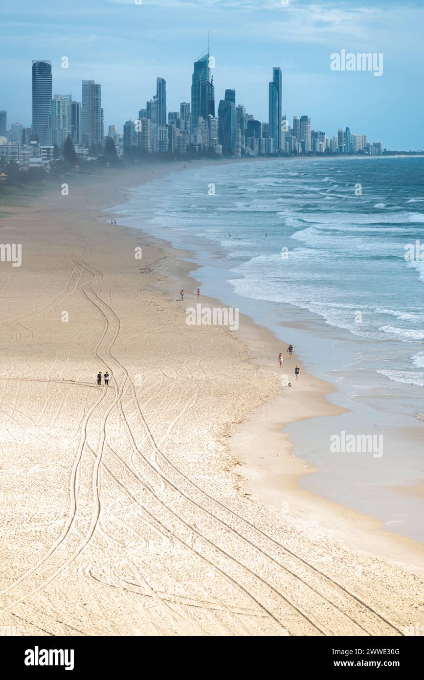 Gold Coast Skyline With People Walking On Beach, Gold Coast, Queensland ...