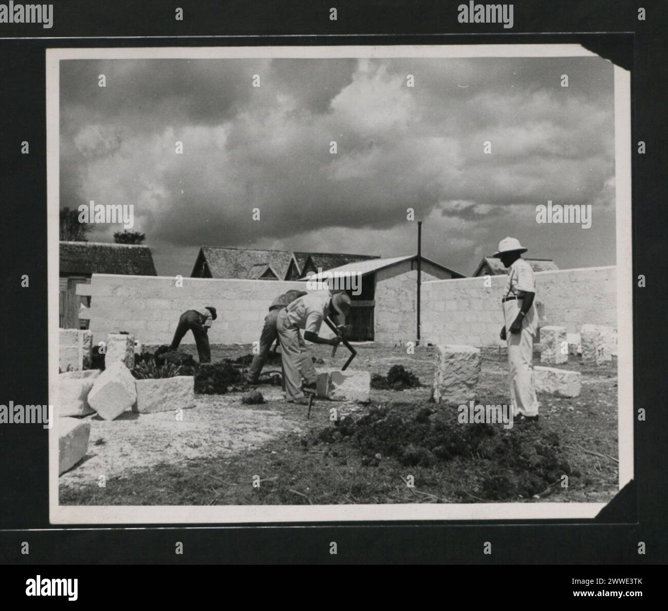 Description: Trimming Coral Stone blocks. Location: Barbados Date: 1947 ...