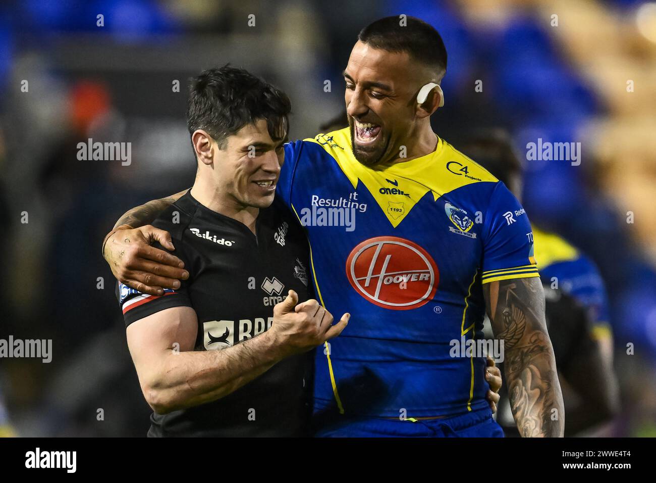 Paul Vaughan of Warrington Wolves and Dean Parata of London Broncos ...
