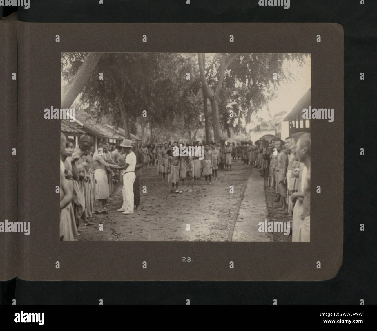 Male deck-passengers on St. John's Island, Singapore, receiving ...
