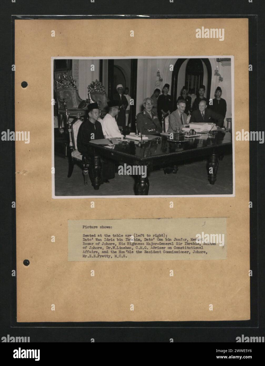 Description: Picture shows: Seated at the table are (left to right ...