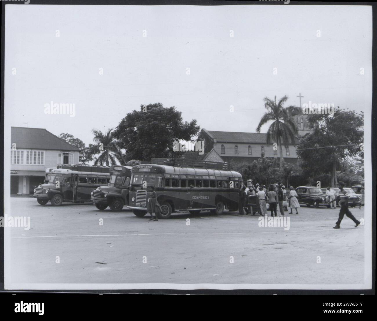 The bus station at Mandeville, Jamaica, in January 1961, shows buses ...