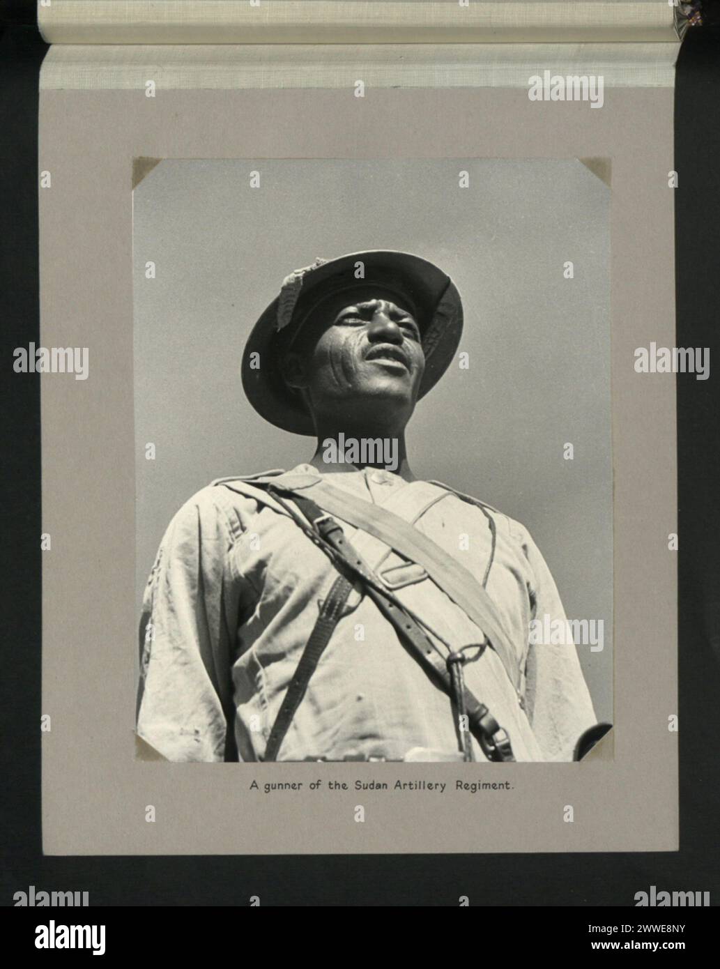 A gunner of the Sudan Artillery Regiment, showing artillery operation ...
