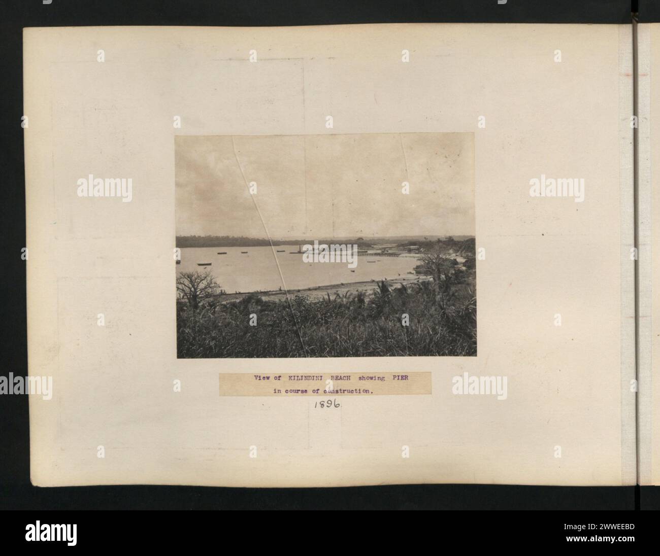 Description: View of Kilindini beach showing pier in course of ...