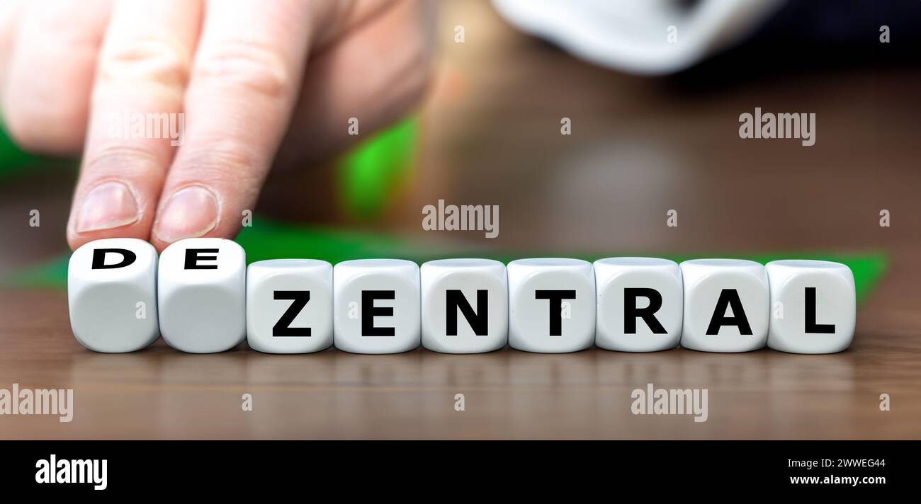 Hand turn dice and changes the German word 'zentral' (centralized) to ...