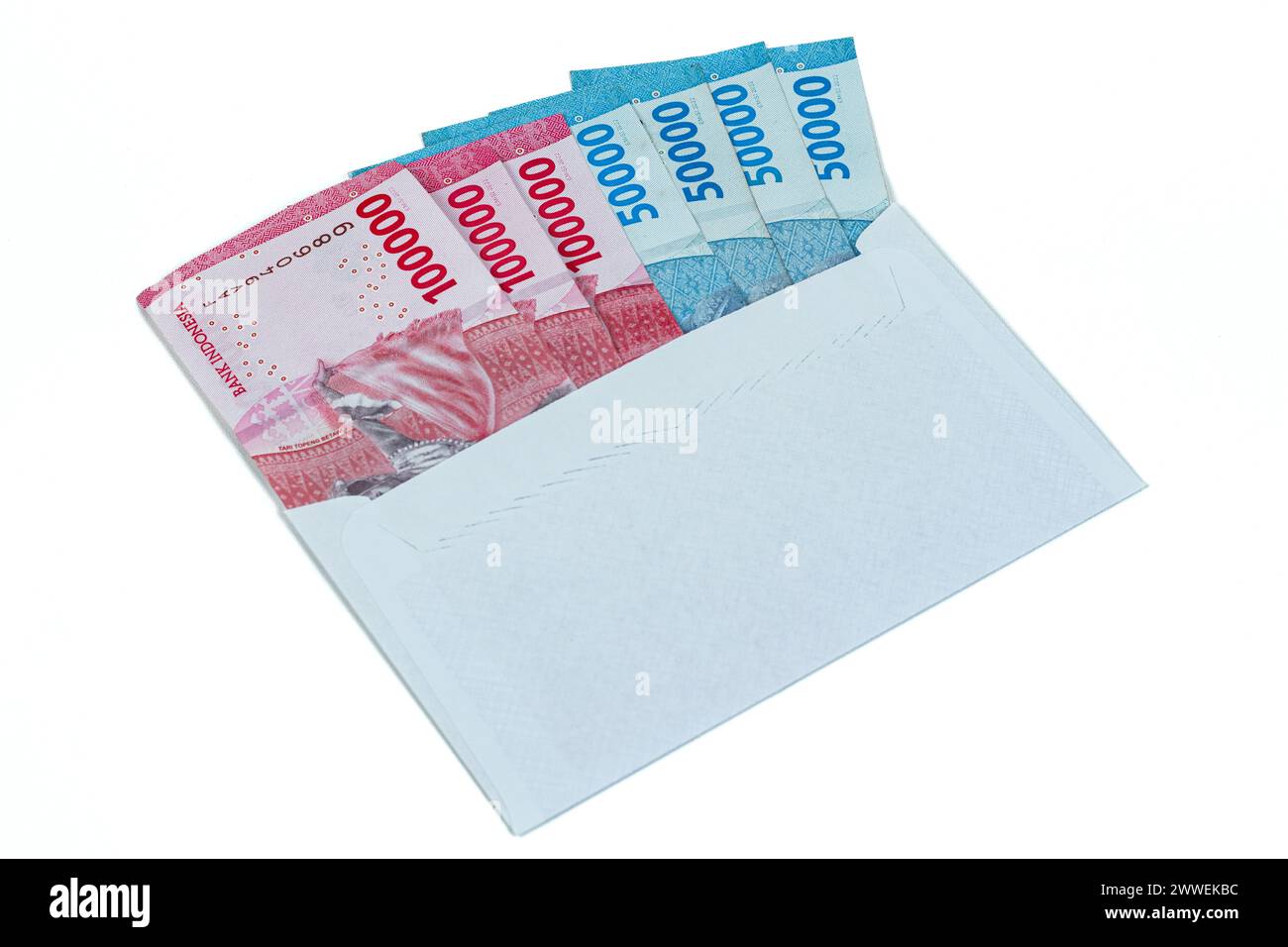 Indonesian rupiah currency. White envelope containing IDR 100,000 and ...