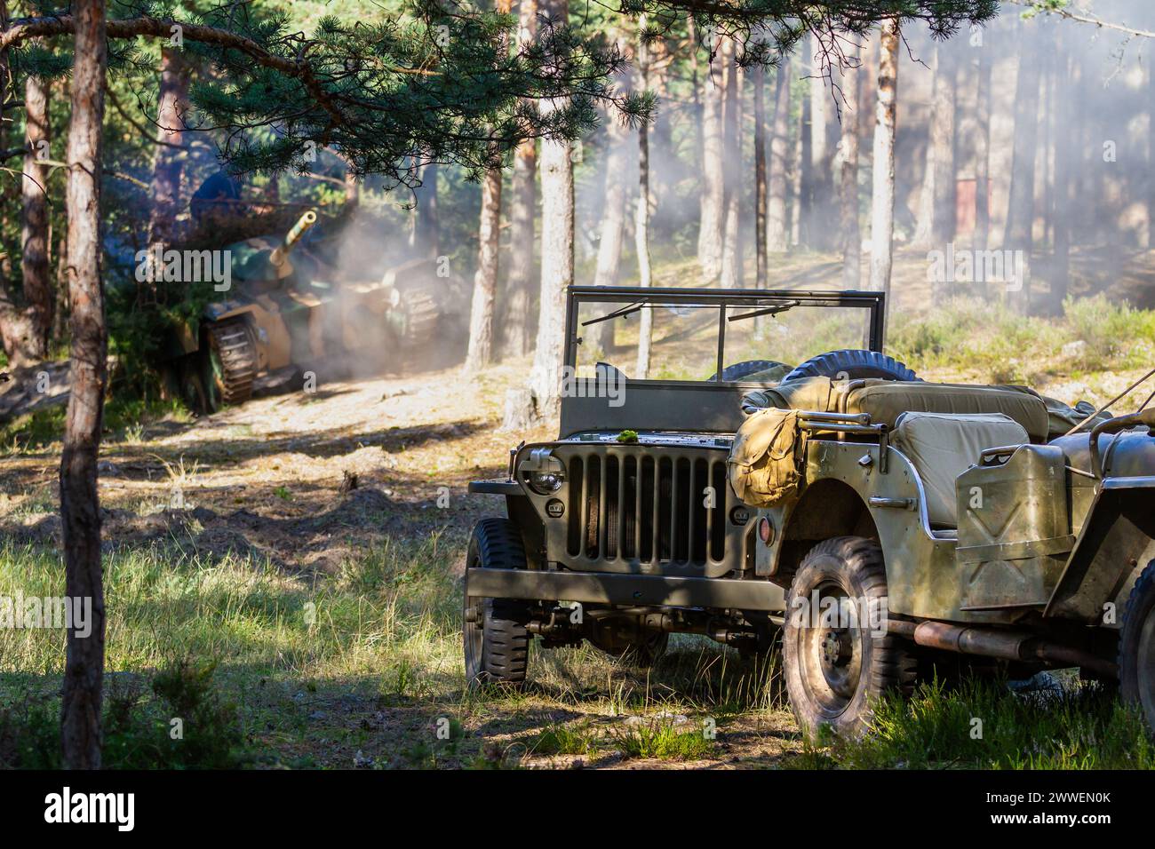 Historical reenactment. Two abandoned US military vehicles stand in the ...