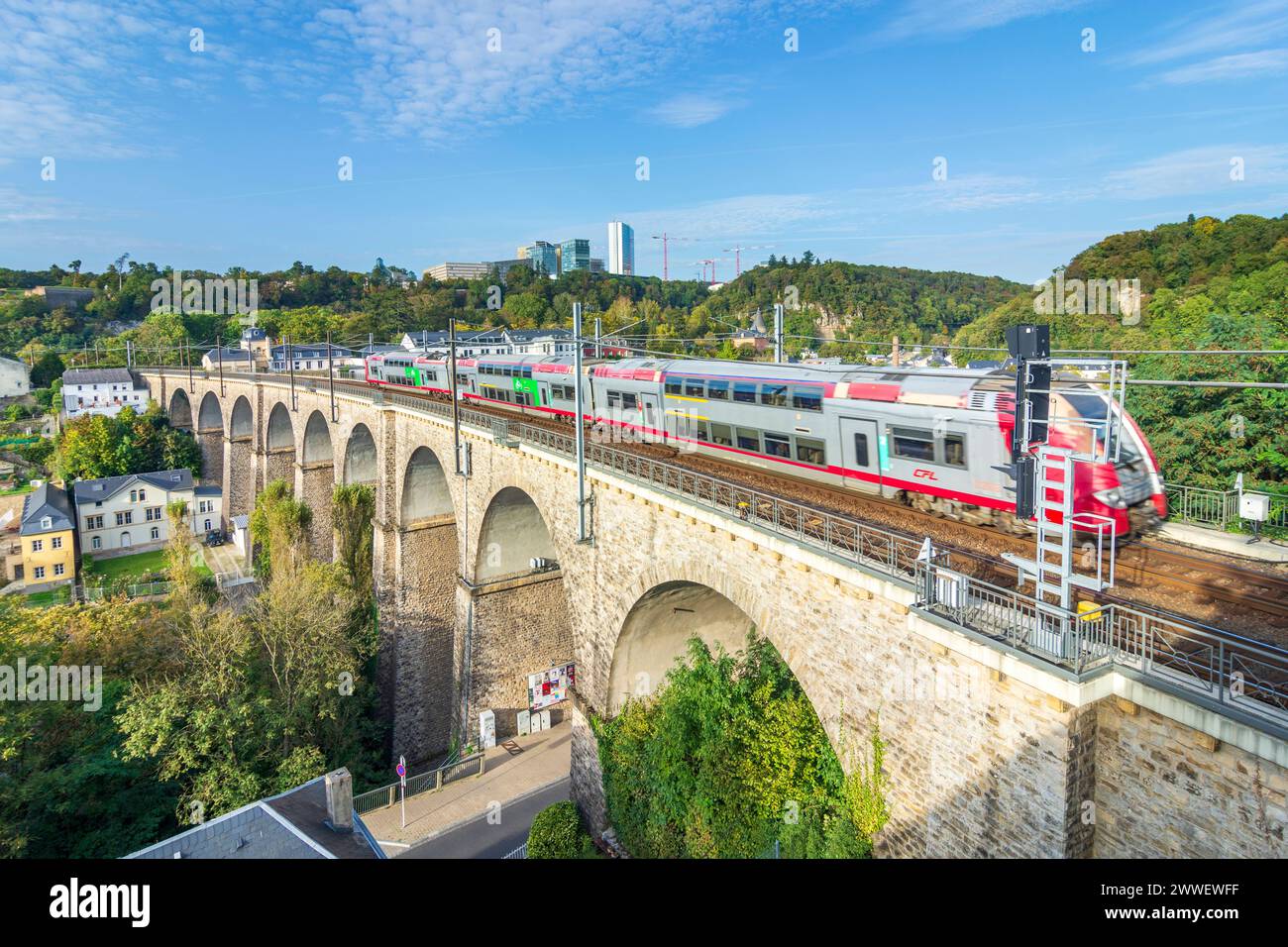railway Clausener Viaduct with regional train of CFL, high-rises in ...