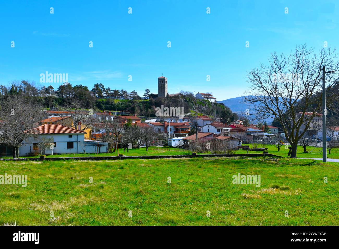 View of Kubed village and a tower at the top of a hill above in Istria ...