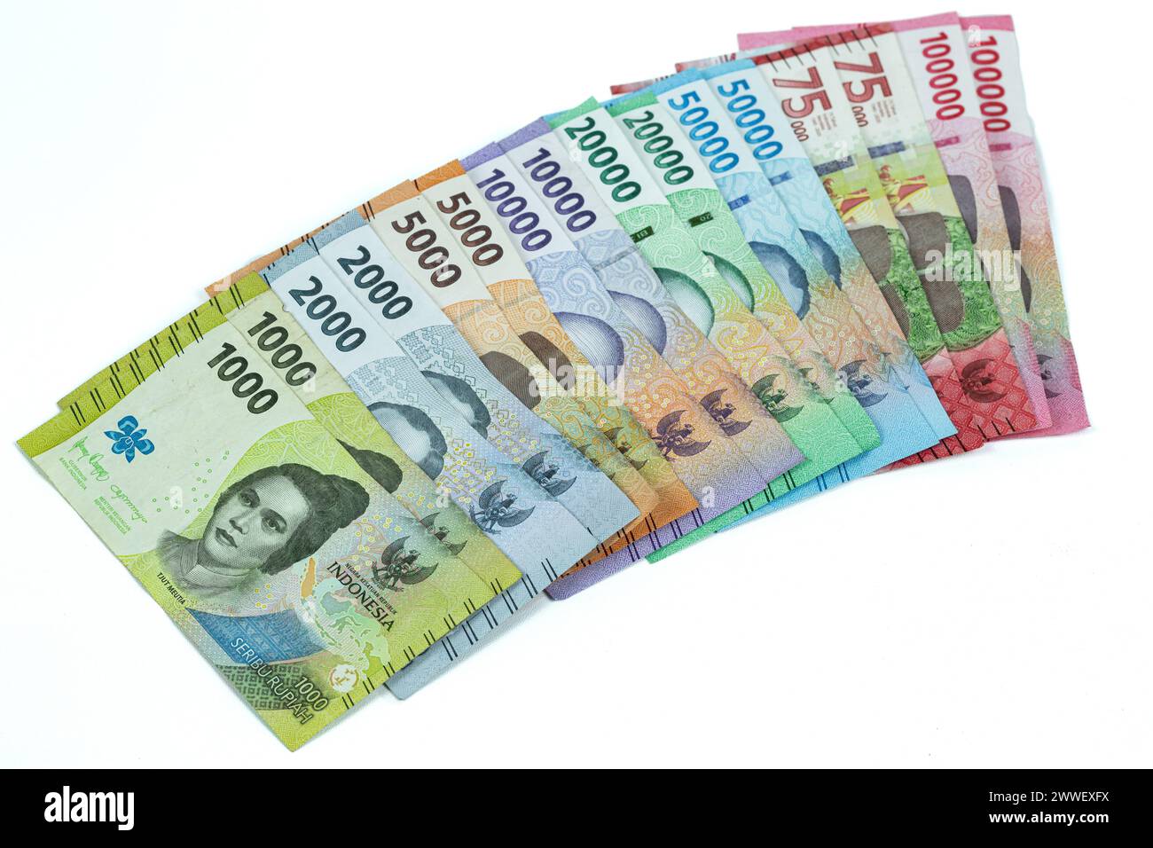 Indonesian currency . Stack of Rupiah or IDR banknotes isolated on ... Indonesian currency . Stack of Rupiah or IDR banknotes isolated on ...