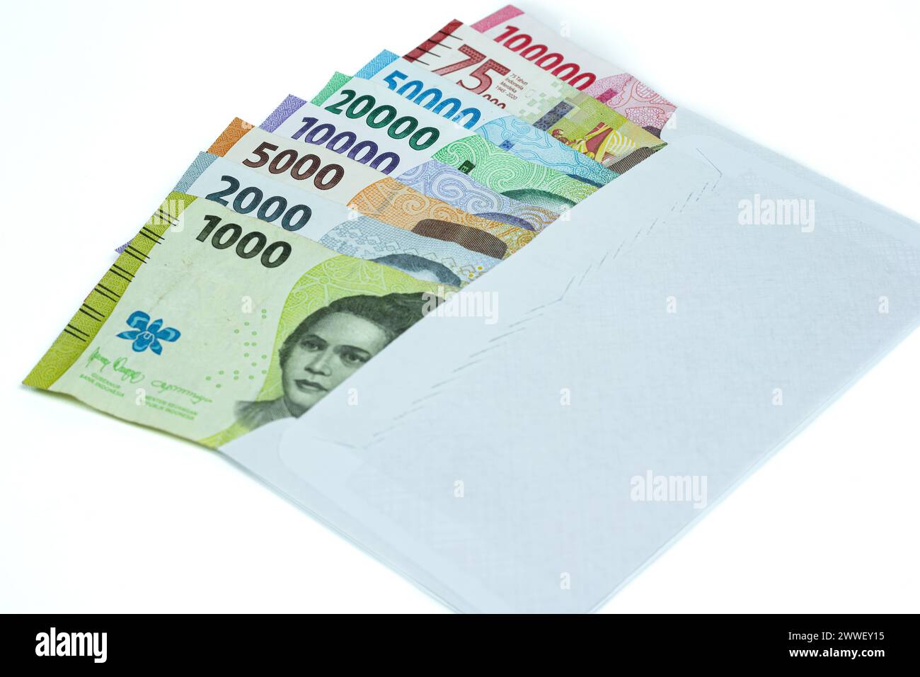 Indonesian currency. Stack of Rupiah or IDR banknotes inside white ...