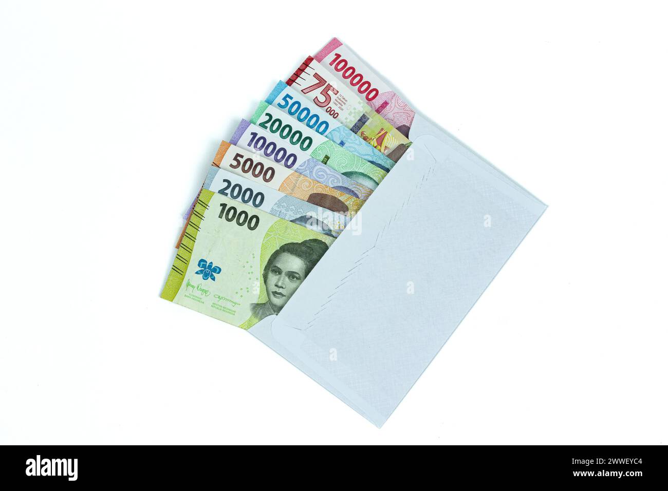 Indonesian currency. Stack of Rupiah or IDR banknotes inside white ...