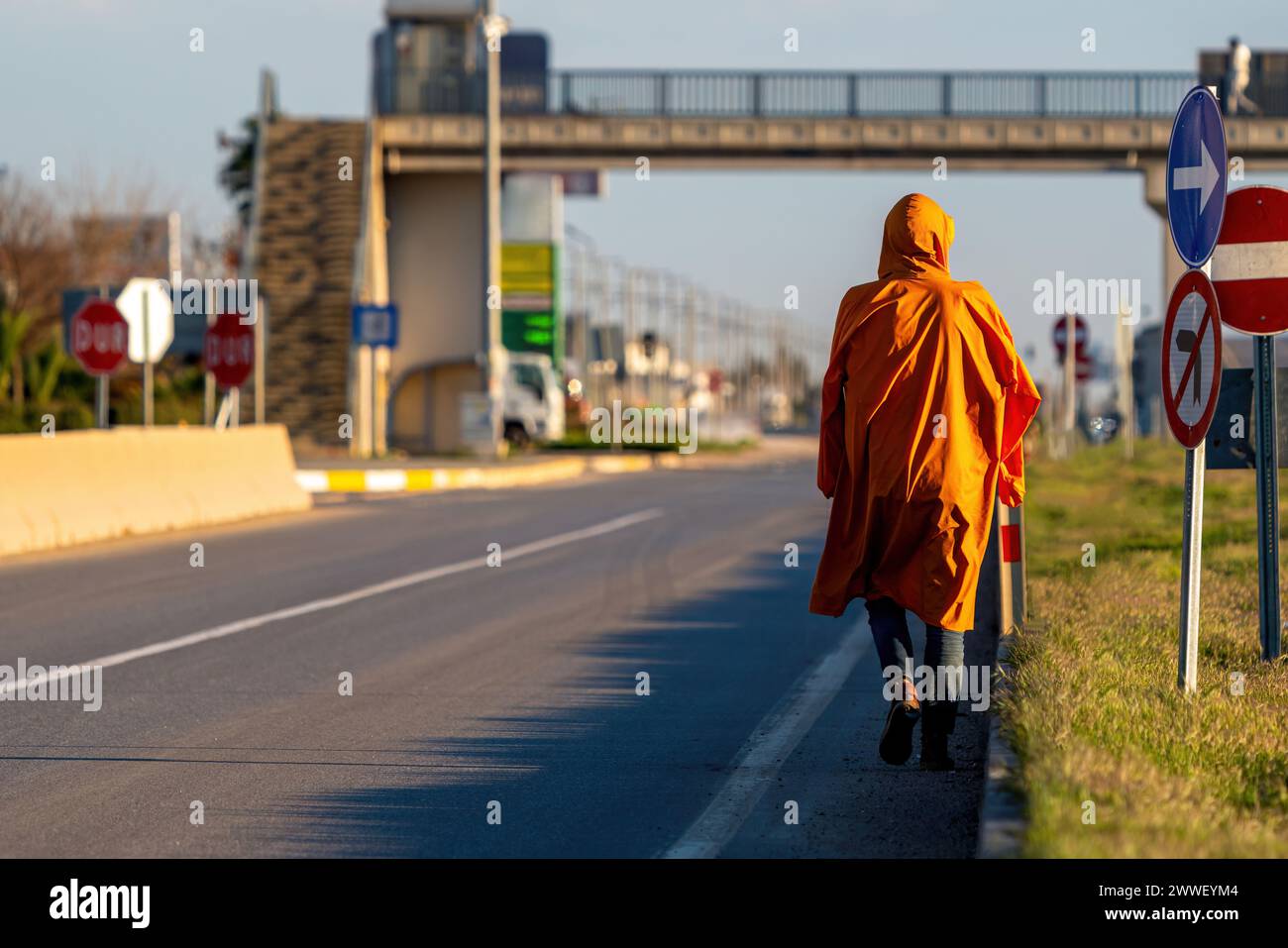 A homeless man walking alone on the motorway. A lonely person Stock ...