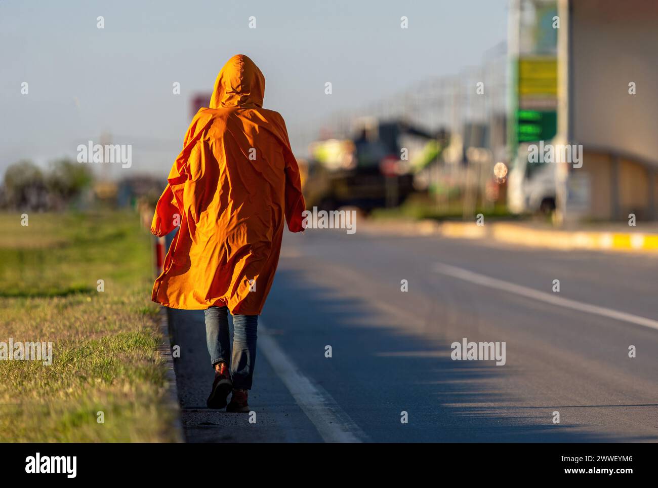 A homeless man walking alone on the motorway. A lonely person Stock ...