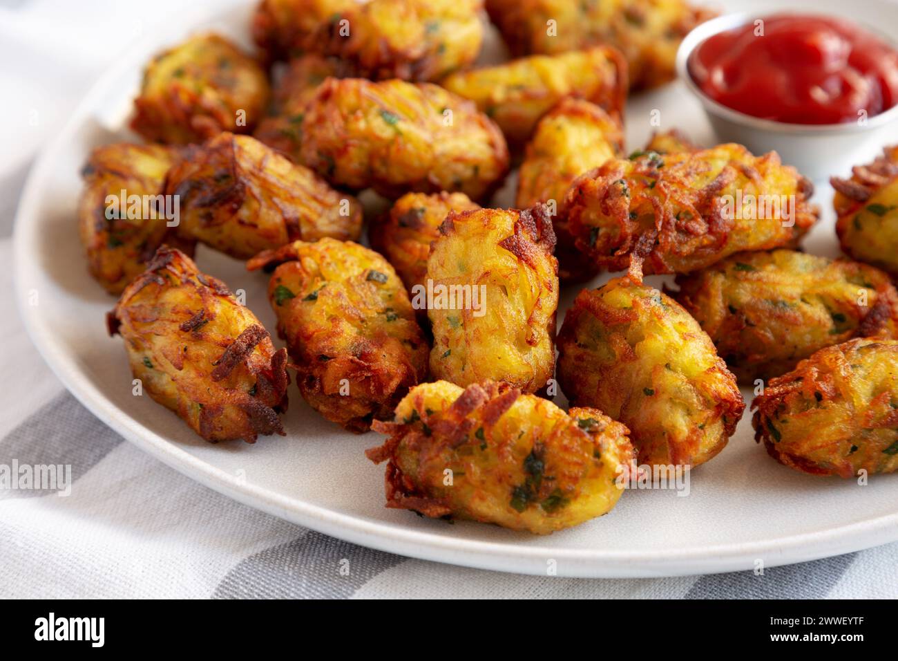 Homemade Fried Tater Tots on a Plate, side view Stock Photo - Alamy