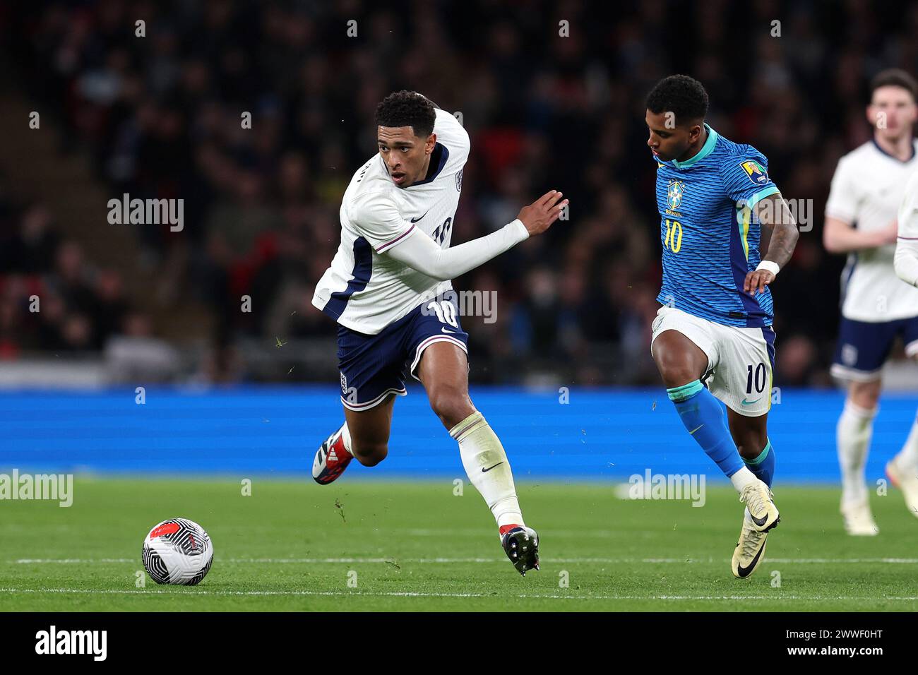 London, UK. 23rd Mar, 2024. Jude Bellingham of England breaks away from ...