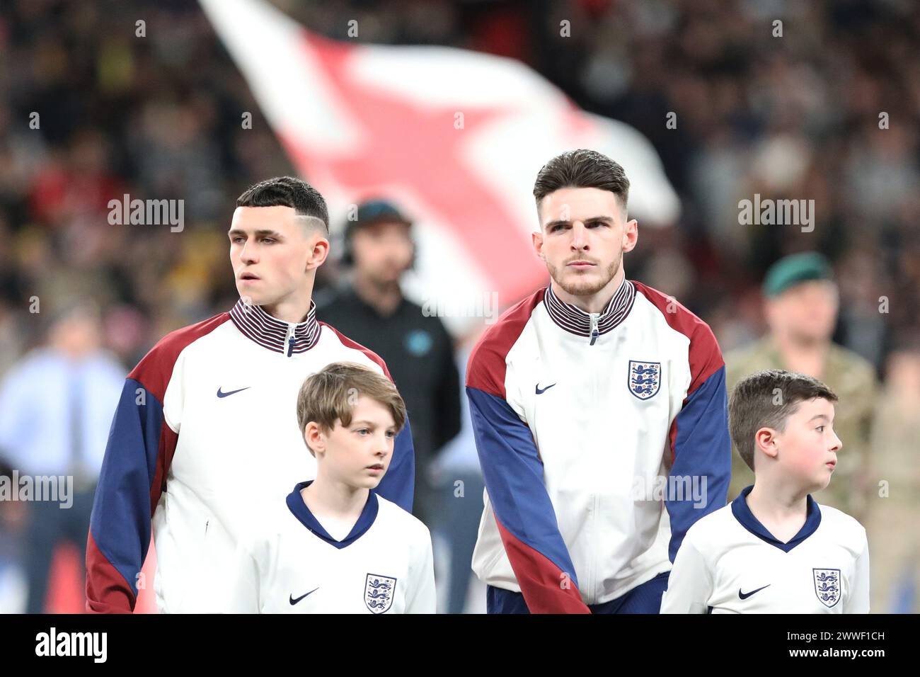 London, UK. 23rd Mar, 2024. Phil Foden and Declan Rice of England line ...