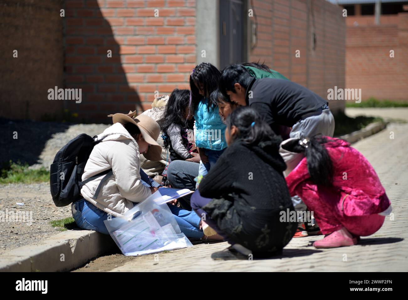 El Alto, Bolivia. 23rd Mar, 2024. A volunteer census taker interviews a ...
