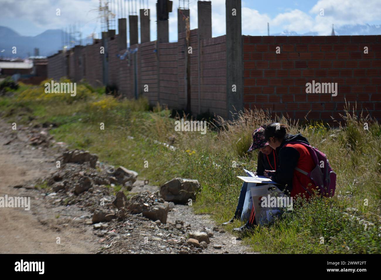 El Alto, Bolivia. 23rd Mar, 2024. Two volunteer census takers control ...