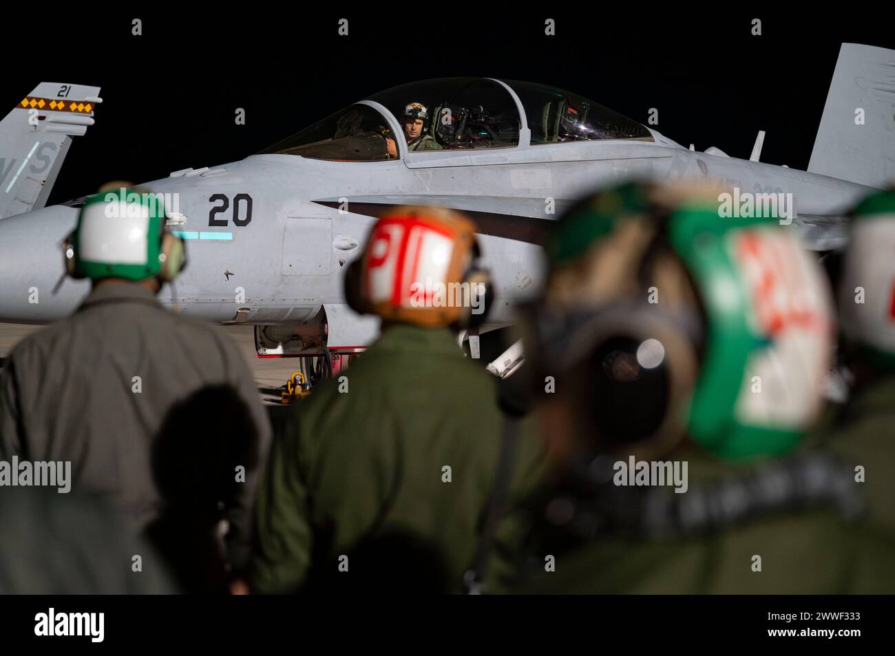 U.S. Marines watch a pilot prepare for a flight during Red Flag, at ...