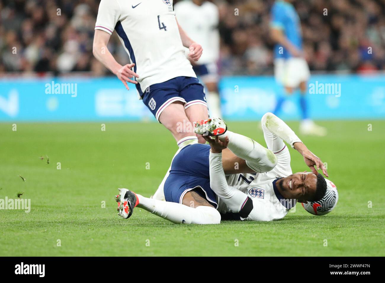 London, UK. 23rd Mar, 2024. Ezri Konsa of England down injured during ...