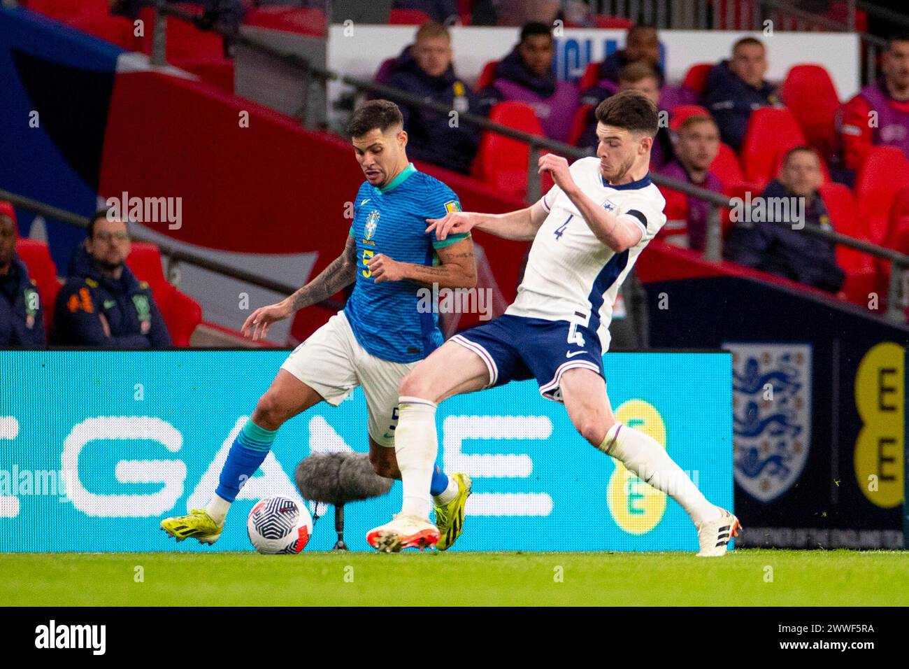 Bruno Guimaraes #5 of Brazil tackled by Declan Rice #4 of England ... Bruno Guimaraes #5 of Brazil tackled by Declan Rice #4 of England ...