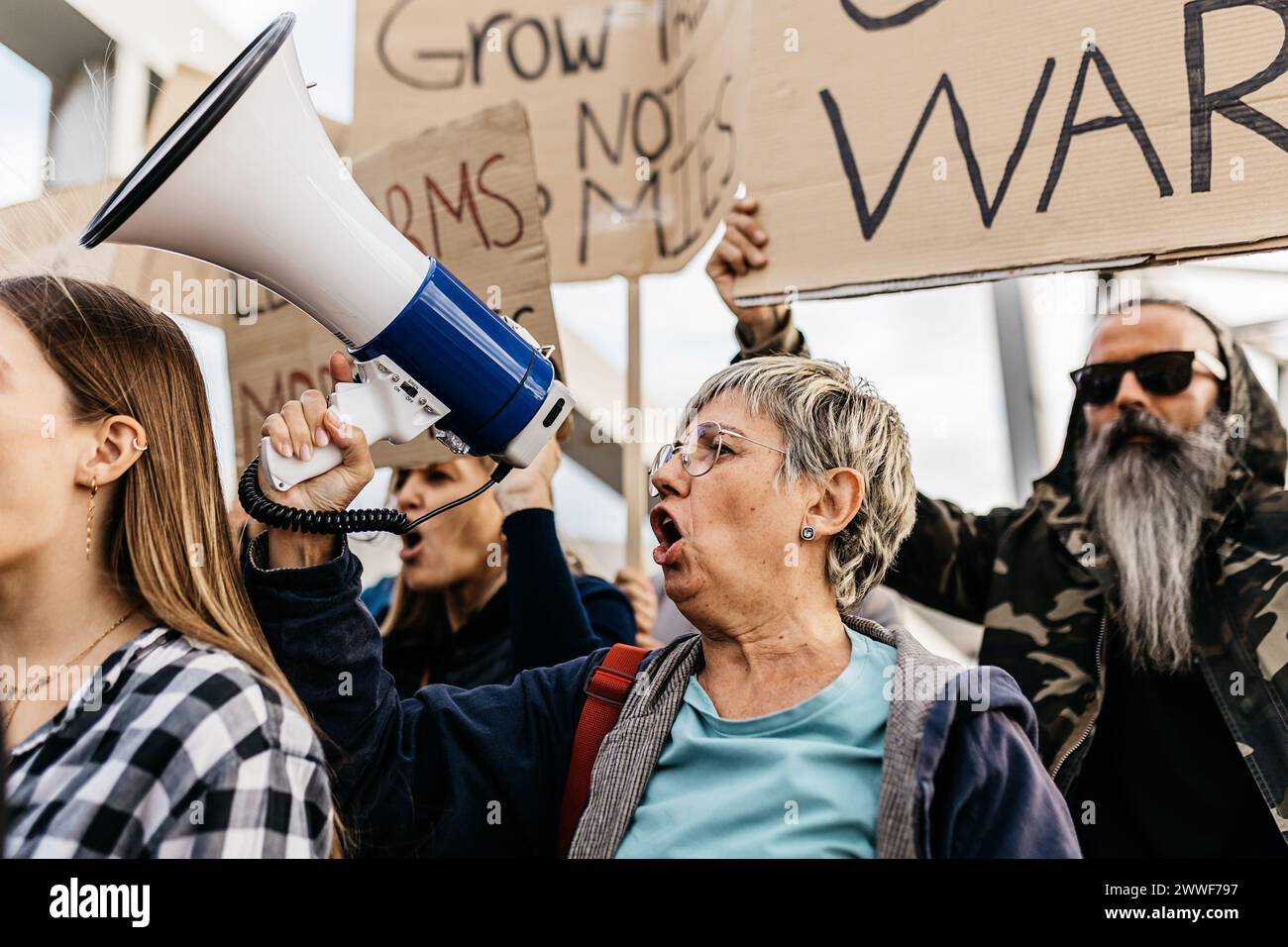 Diverse group of activists people protesting against war and violence ...