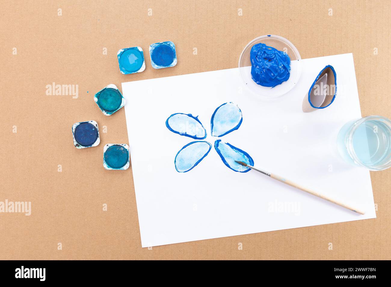 making paper craft butterflies, stamp, paint tubes, recycling concept ...