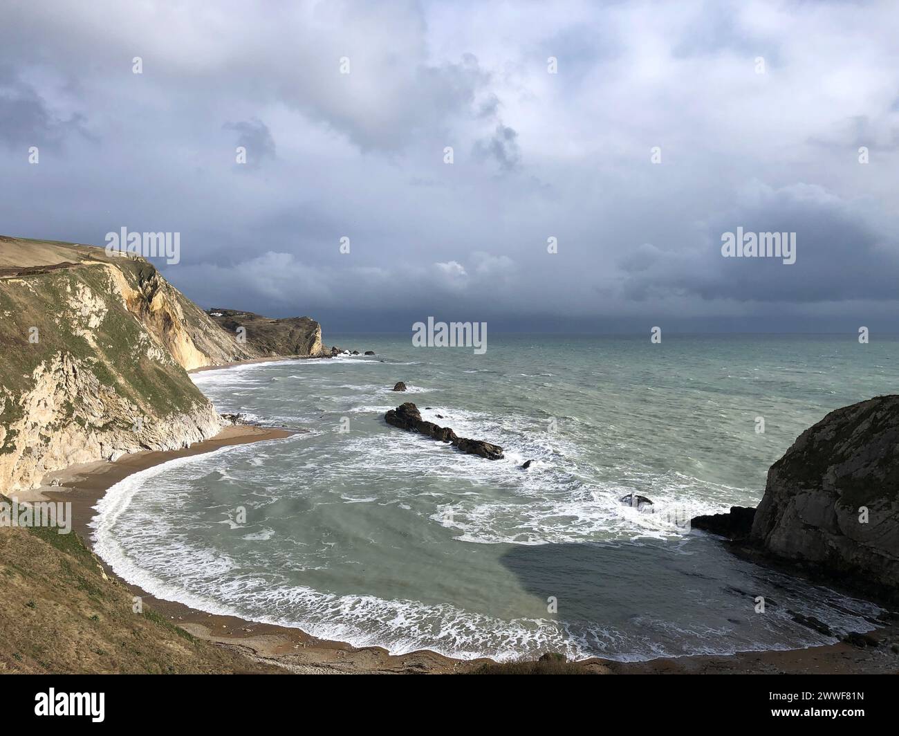 Rocks and sea at Man O'War Cove off the Dorset coast, in March, Dorset ...