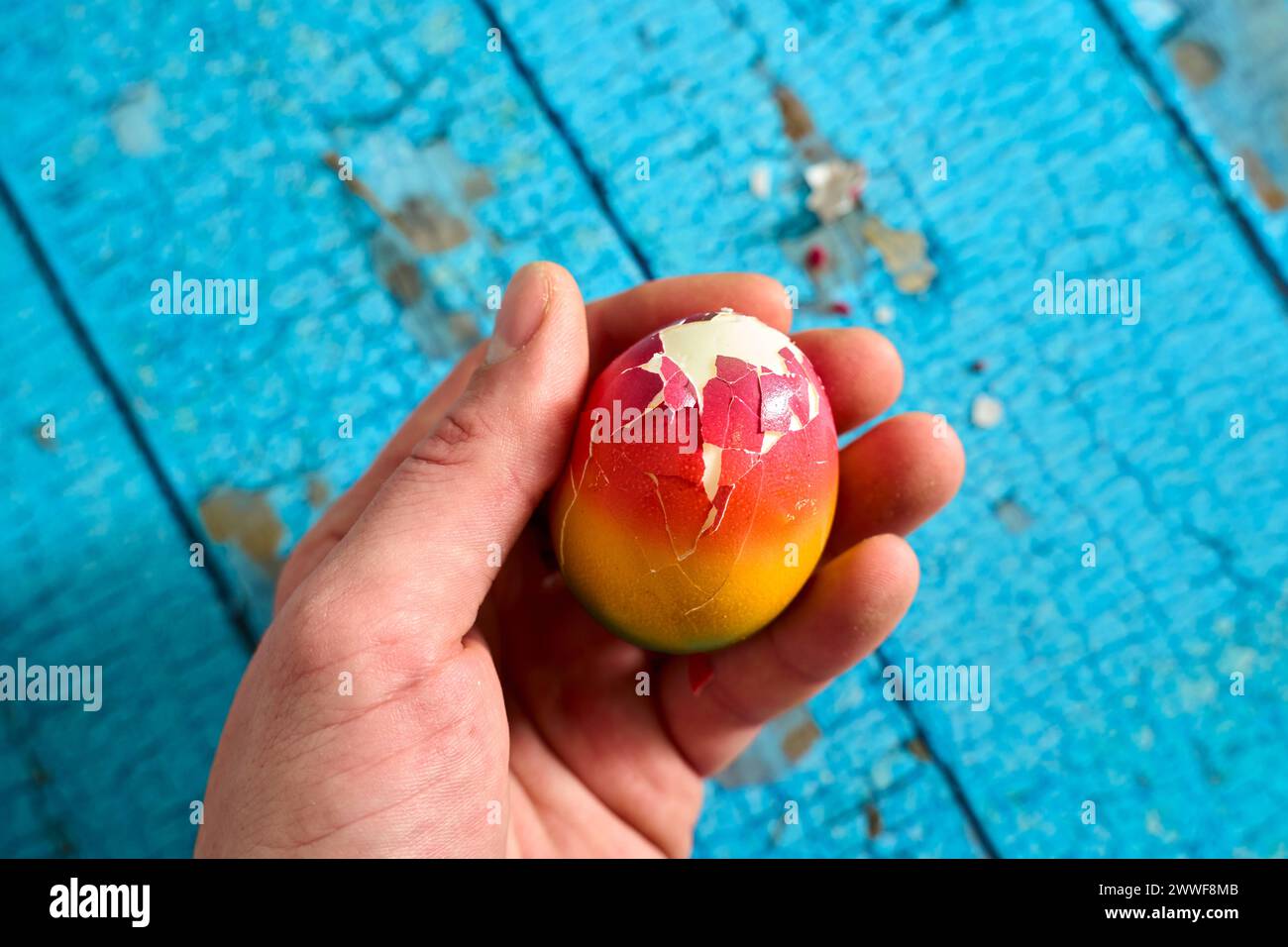 Augsburg, Bavaria, Germany - March 23, 2024: Hand holding a broken ...