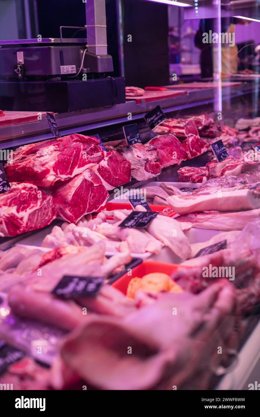 vertical portrait An assortment of meat cuts, including beef, pork, and ...