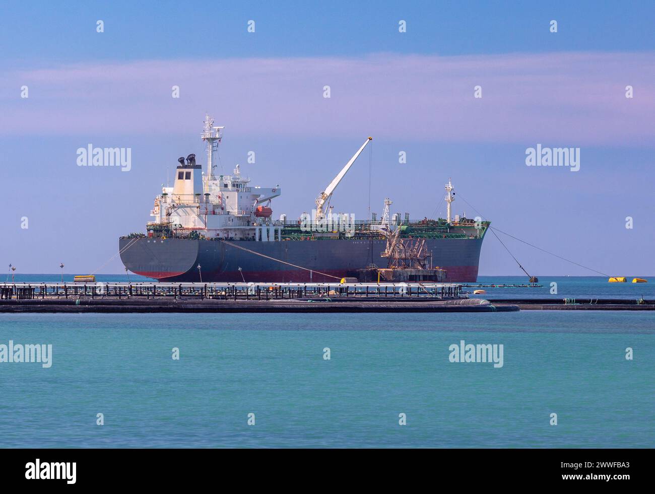 A large oil tanker against the backdrop of the Mediterranean Sea near ...